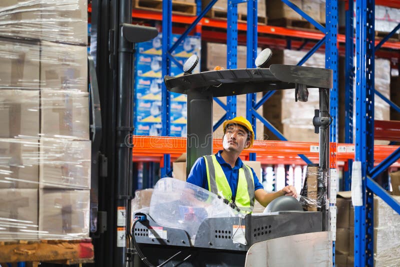 Worker on Forklift, Manual Workers Working in Warehouse, Worker Driver ...