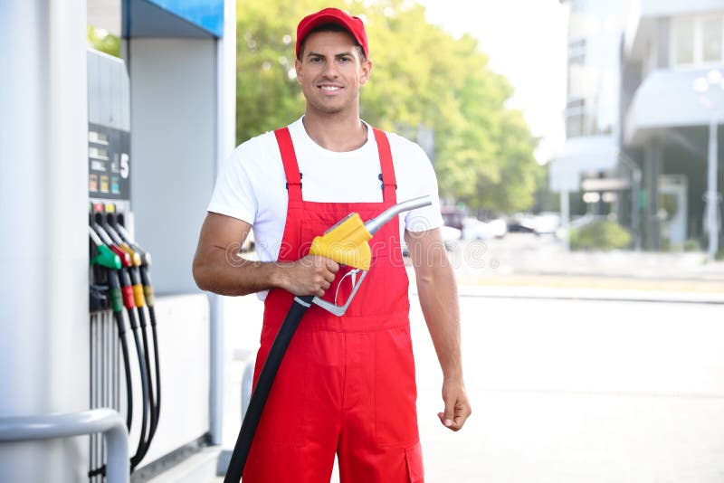 Worker with Fuel Pump Nozzle at Modern Gas Station Stock Photo - Image ...