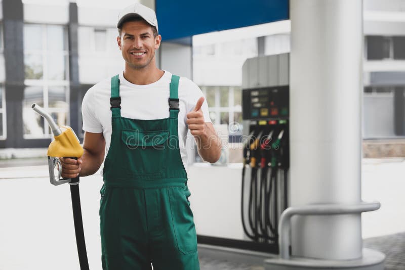 Worker with Fuel Pump Nozzle at Modern Gas Station Stock Image - Image ...