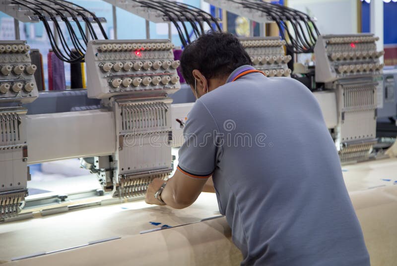 Worker in garment industry editorial photography. Image of horizontal ...