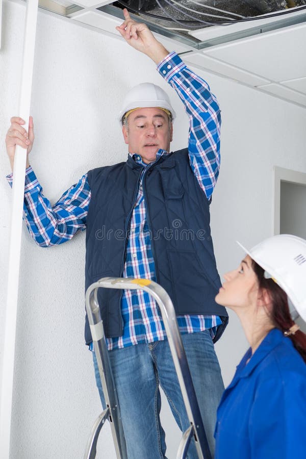 Worker Giving Instructions about Wiring on Ceiling Stock Photo - Image ...