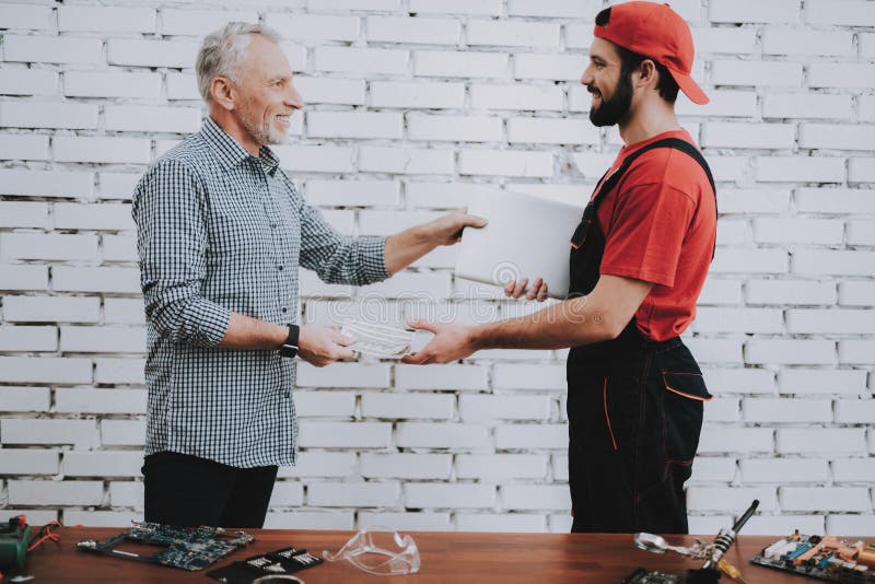 Worker Giving To Man Fixed Laptop in Workshop Stock Image - Image of ...