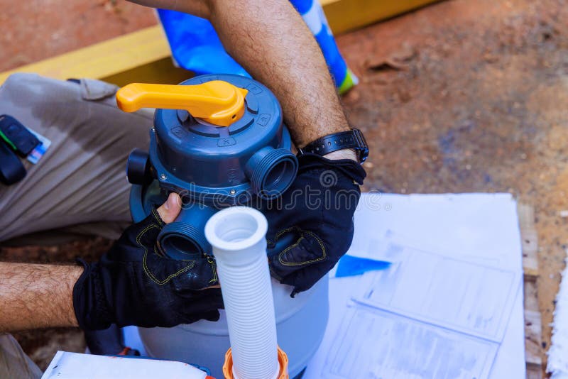 Technician Repairs Pool Equipment during Outdoor Maintenance in ...