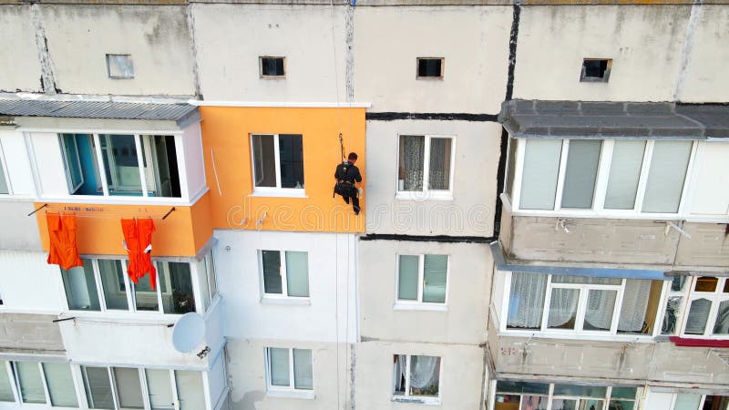 Worker Go Down To a Construction Site of a High-rise Building ...