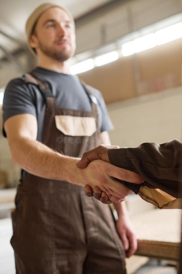 Worker Greeting His Colleague at Work Stock Photo - Image of uniform ...