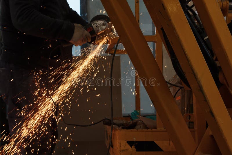 Worker Grinding Cutting Metal Sheet with Grinder Machine and Sparks ...