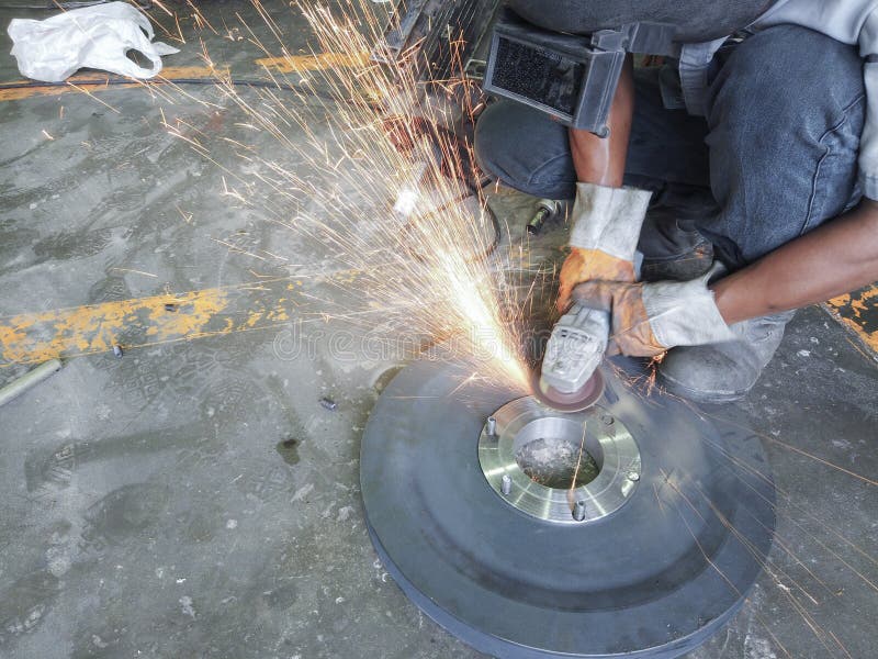 Worker Grinding and Cutting Steel Plate with a Lot of Spark Stock Photo ...