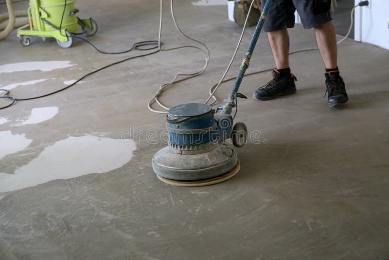 Worker Grinding the Floor Using a Single Disc Machine Stock Image ...