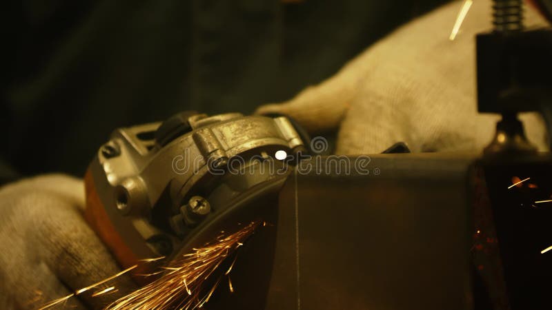 Worker Grinding Iron. Heavy Industry Factory Interior with Worker Using ...