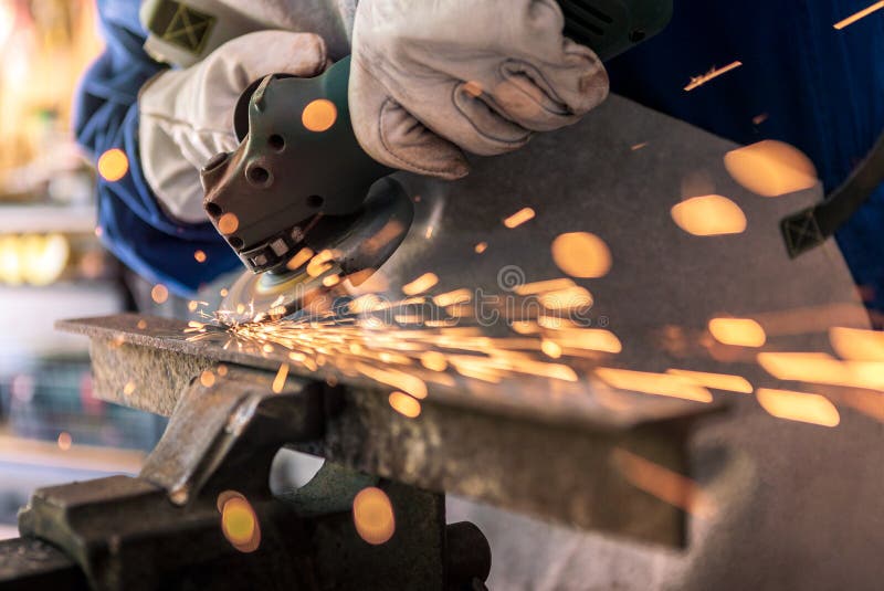 Worker Grinding Metal with a Grinder and Cleaning Steel Seam. Working ...