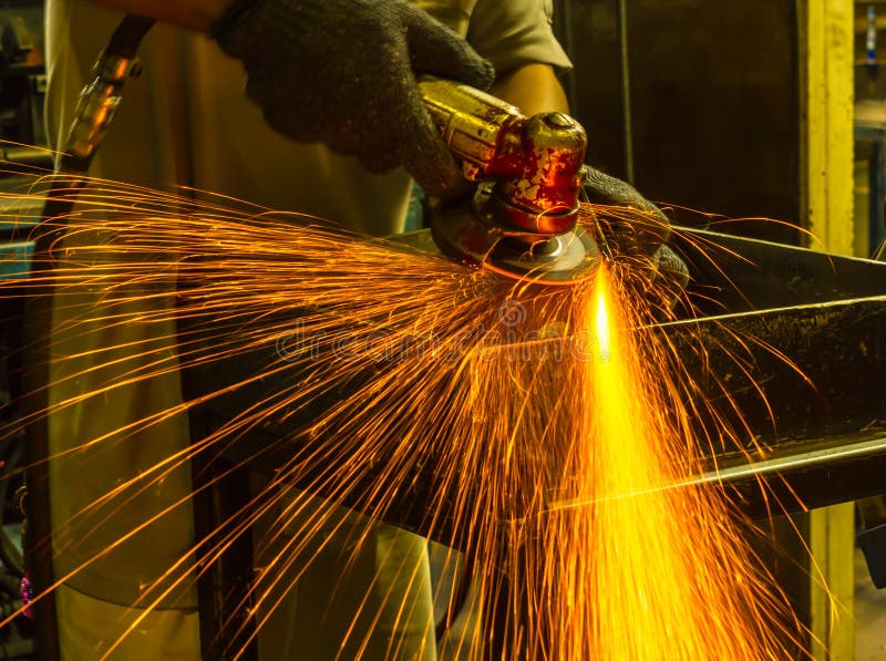 Worker grinding metal stock photo. Image of light, manual - 70110308