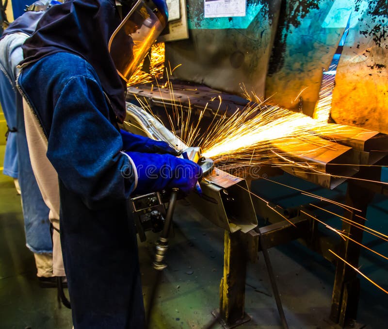 Worker grinding metal stock image. Image of abrasive - 69478987