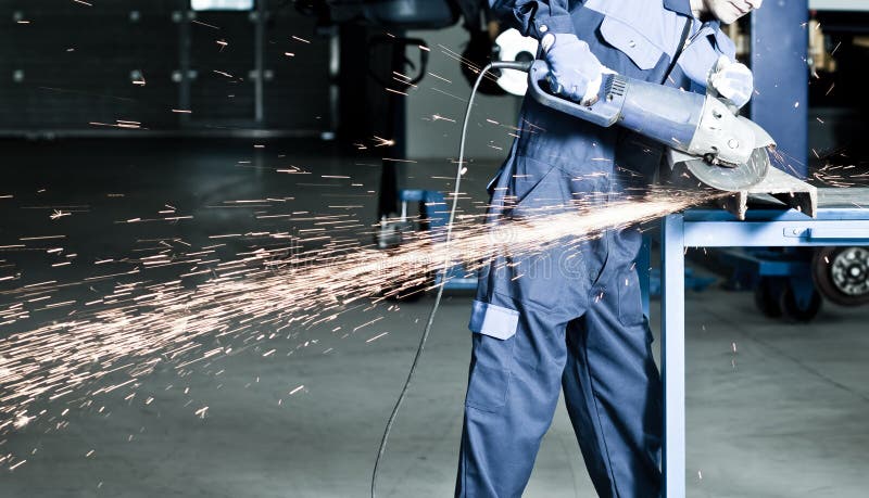The worker grinding metal stock image. Image of production - 81215623