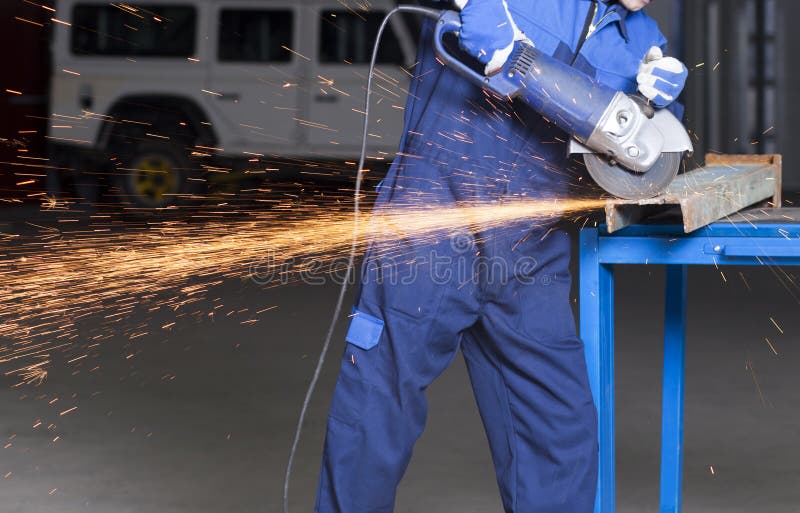 Worker Grinding a Metal Plate Stock Image - Image of garage, safety ...
