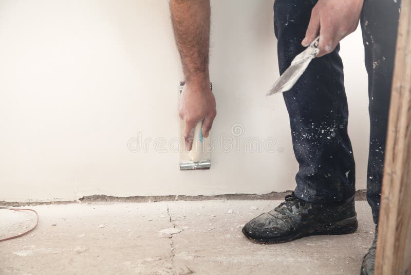 Worker Grinding Wall with Sandpaper. Renovation Stock Image - Image of ...