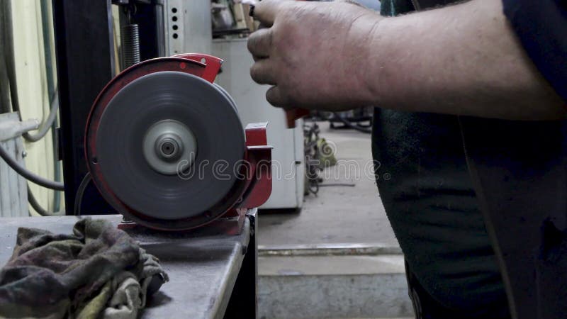 Worker Grinds a Brake Pad on a Grinding Machine Stock Footage - Video ...