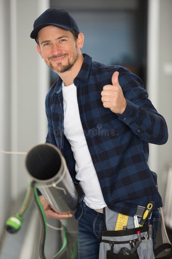 Worker with Gripper in Hand Fixing Pipe Stock Image - Image of service ...