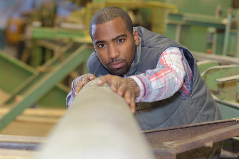 Worker Guiding Round Wooden Pole into Machine Stock Image - Image of ...