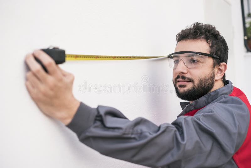 The worker guy measuring stock photo. Image of posing - 103264522