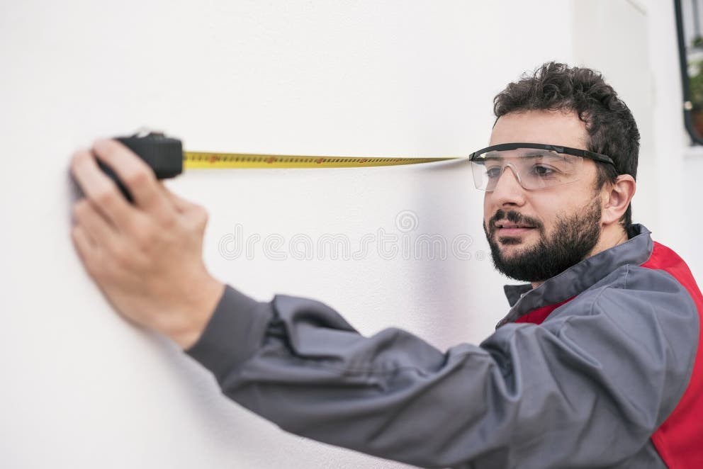 The worker guy measuring stock photo. Image of eastern - 103264492