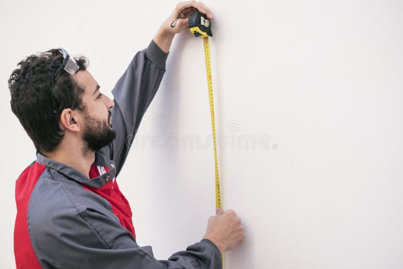 The worker guy measuring stock photo. Image of posing - 103264522