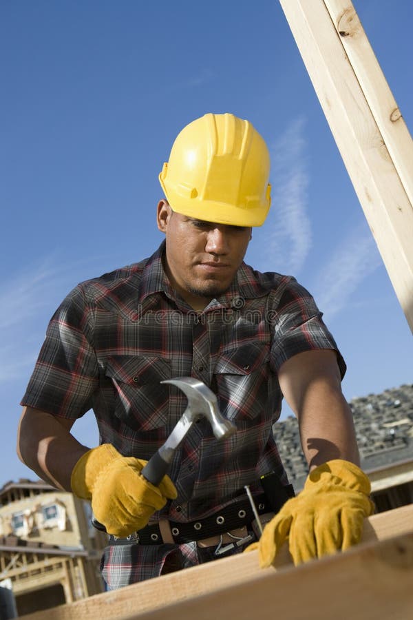 Man Worker Hammering while Building Wooden Frame House. Stock Photo ...