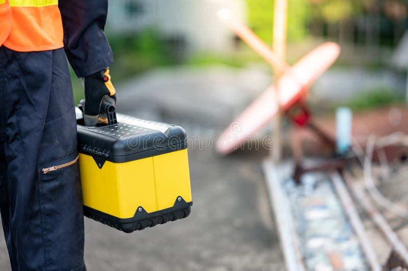 Worker Hand Carrying Tool Box at Construction Site Stock Image - Image ...