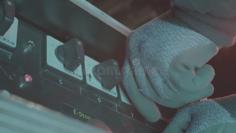 Worker Hand Turns Emergency Stop Levers on Control Panel Stock Footage ...