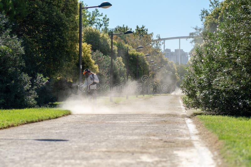 A Worker with a Hand-held Lawn Stock Image - Image of forest, person ...