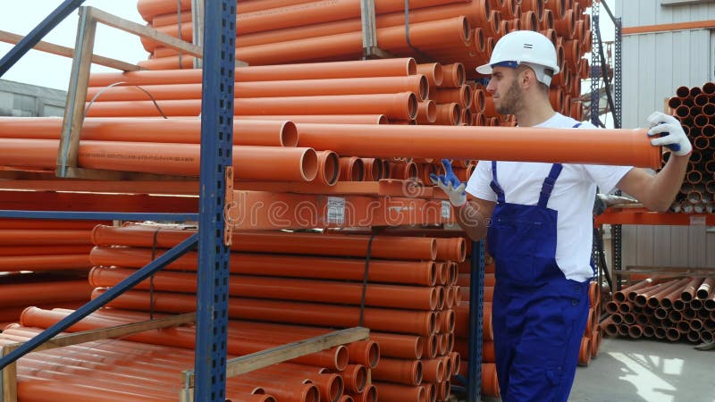 Worker Hand Take Plastic Pipe for Sewage Systems in Warehouse Stock ...