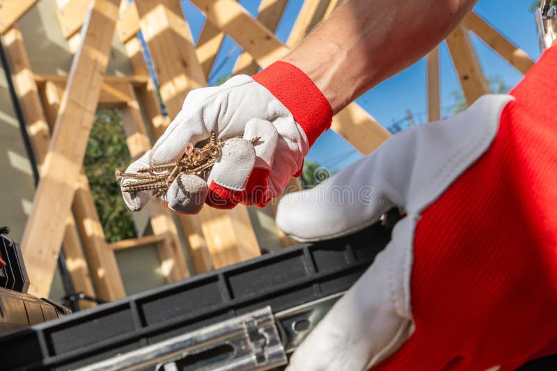 Worker Handling Small Construction Materials at a Building Site during ...