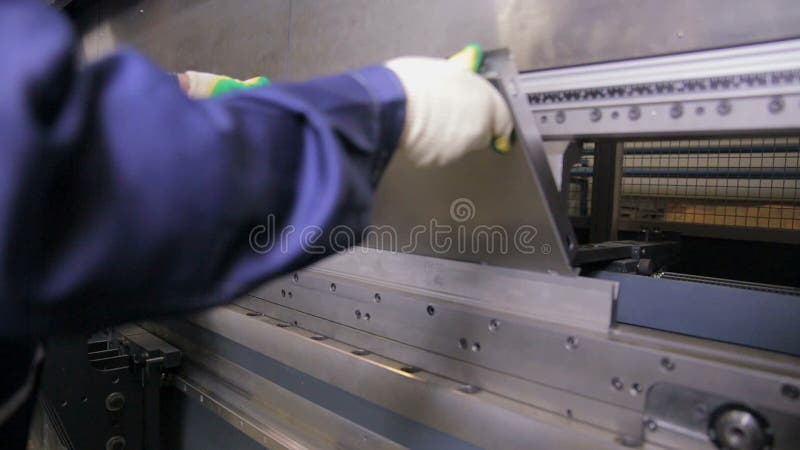 Worker Hands Bend Metal Sheet on a Modern Bending Industrial Machine at ...
