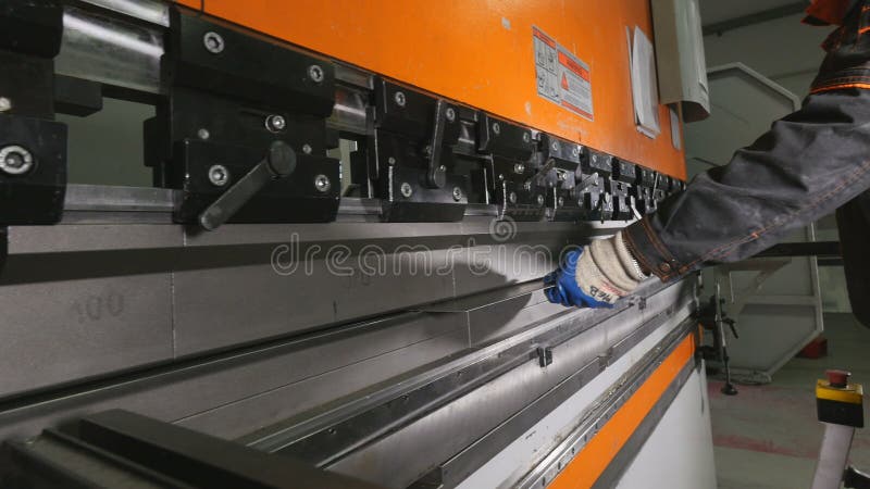 Worker Hands Bend Metal Sheet on a Modern Bending Industrial Machine at ...