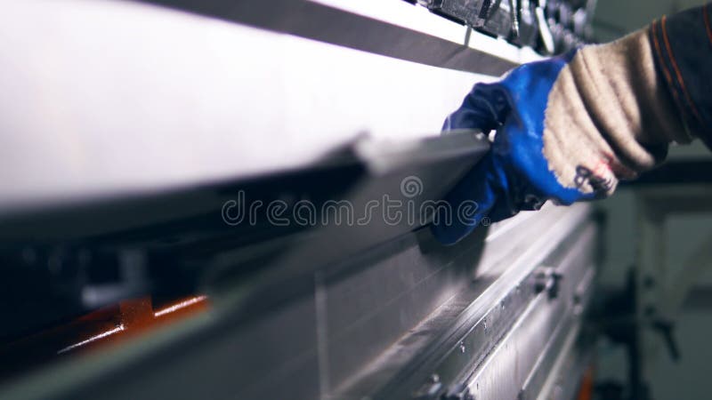 Worker Hands Bend Metal Sheet on a Modern Bending Industrial Machine at ...