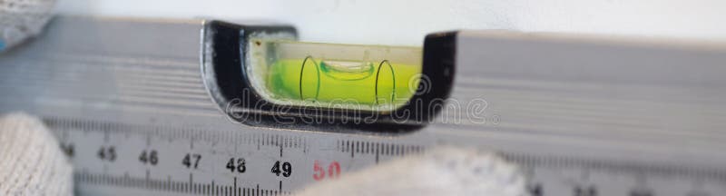 Worker Hands Check the Evenness of the Wall with a Special Tool for ...