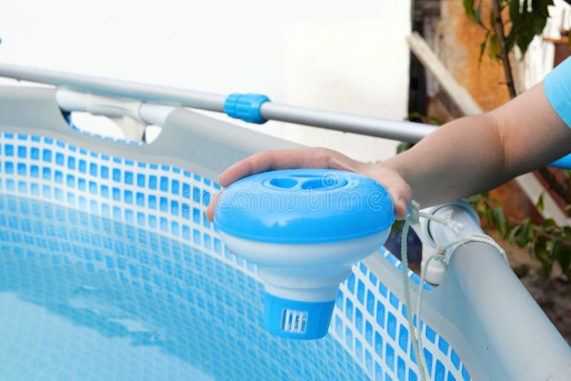 Worker Hands Isinfection and Chlorination of Water in the Pool ...
