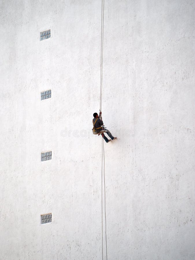 Worker Hanging from Rope on Building Wall Editorial Stock Image - Image ...