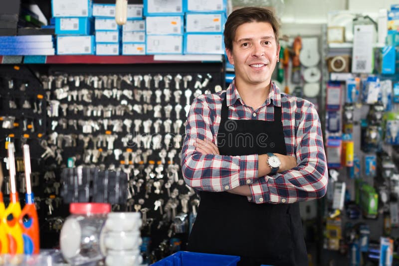Worker in Hardware Store Trading Goods for Water Tap in Uniform Stock ...