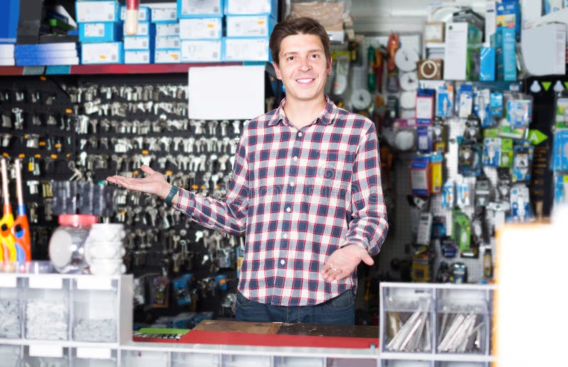 Worker in Hardware Store Trading Goods for Water Tap in Uniform Stock ...