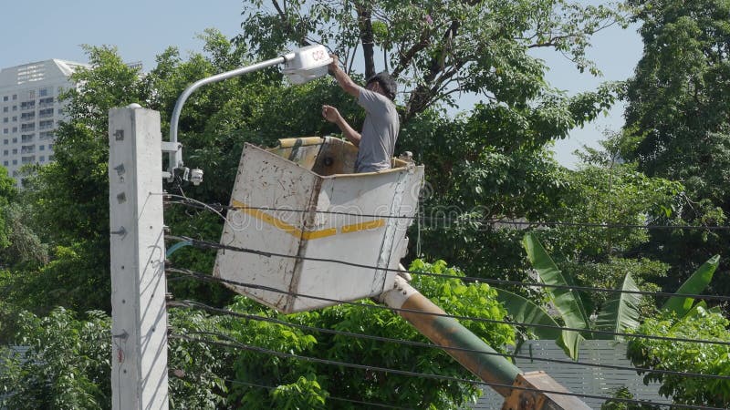 Worker on Height Lifting Platform Installing New Street Light Bulb ...
