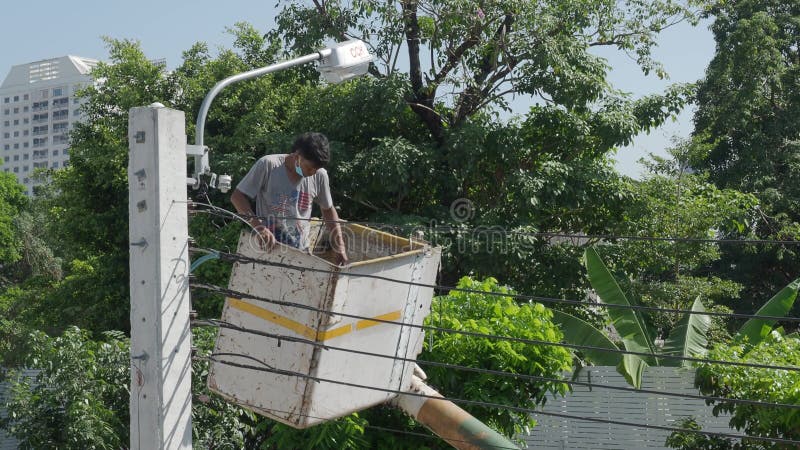 Worker on Height Lifting Platform Installing New Street Light Bulb ...