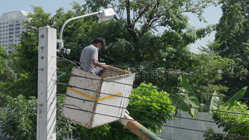 Worker on Height Lifting Platform Installing New Street Light Bulb ...