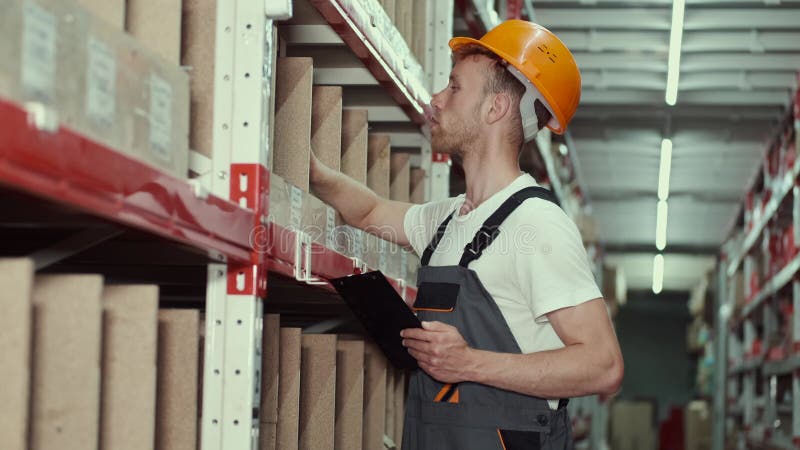 Worker in Helmet is Checking Materials at the Factory Stock Video ...