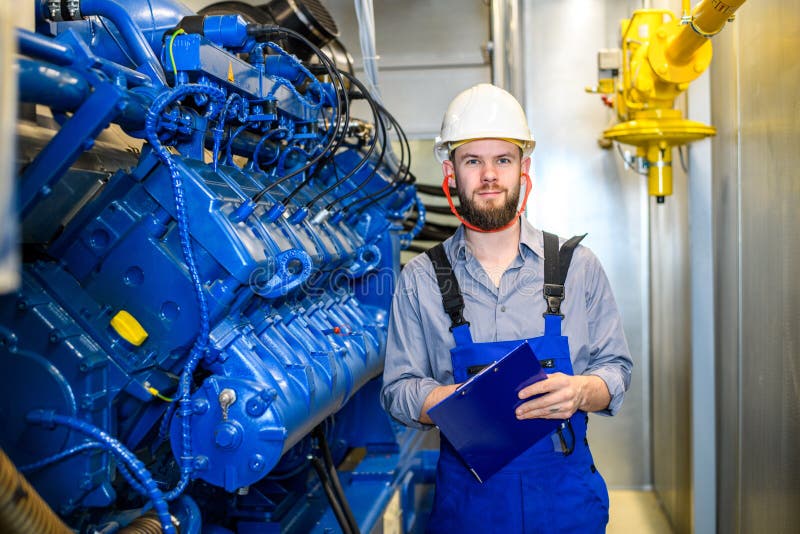 Worker with Helmet Working on Big Generator Stock Photo - Image of pipe ...