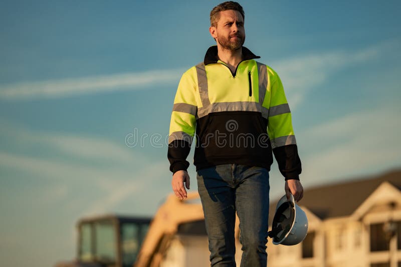 Worker in Helmet on Site Construction. Man Excavator Bulldozer Worker ...