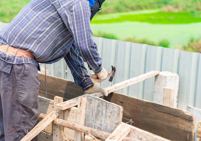Worker Hit Nails on Wood Bar for Support Formwork Stock Image - Image ...