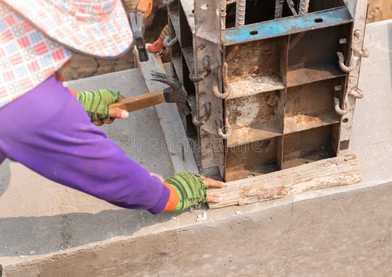 Worker Hit Nails on Wood Bar for Support Pole Formwork Stock Photo ...