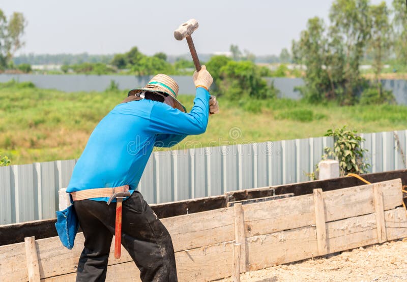 Worker Hit Pile for Reinforce Formwork Building Concrete Foundation ...