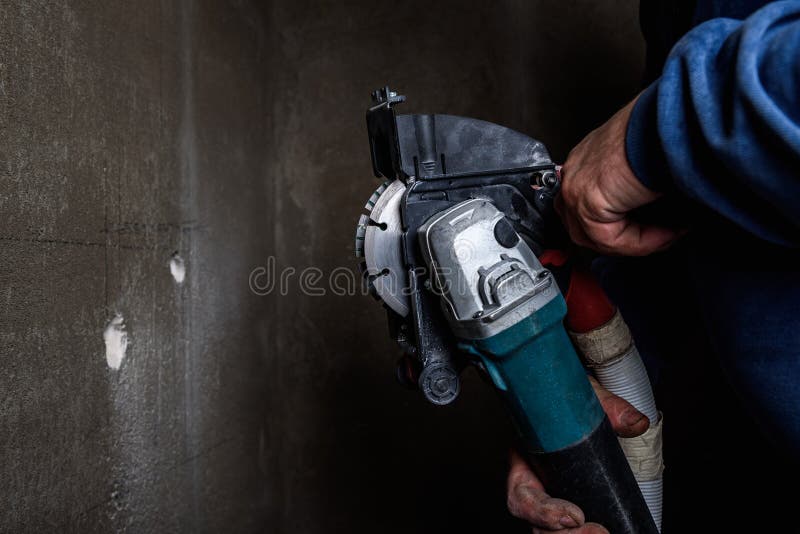 Worker Holding Angle Grinder with Two Diamond Discs for Cutting Grooves ...