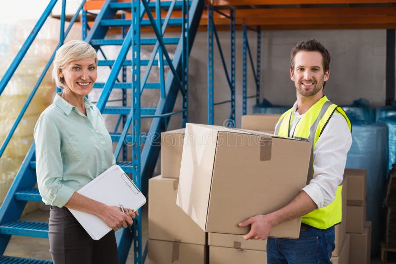 Worker Holding Box with Manager Holding Clipboard Stock Photo - Image ...